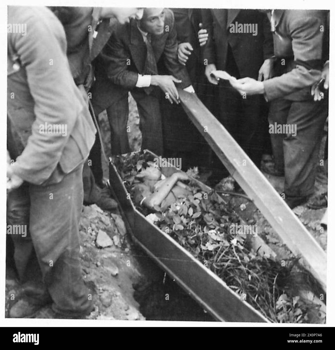 During Greek customs, relatives of the deceased raise the lid of the ...