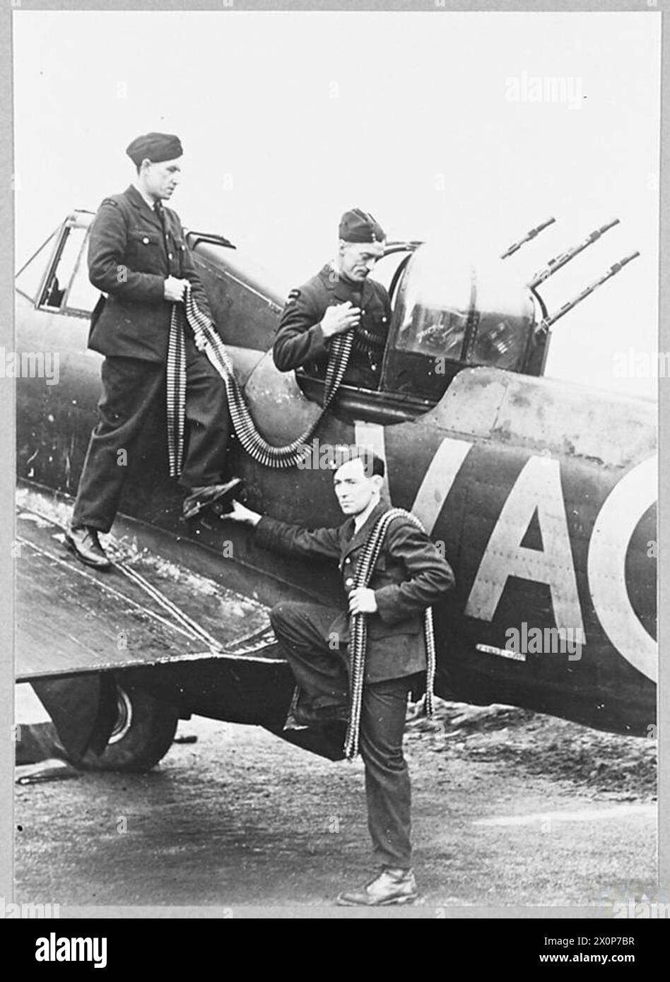 Newfoundland Squadron RAF armourers work on squadron aircraft. A/C Bill ...