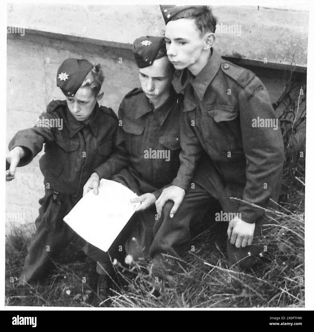 An American officer assists a commando boarding a craft during a ...