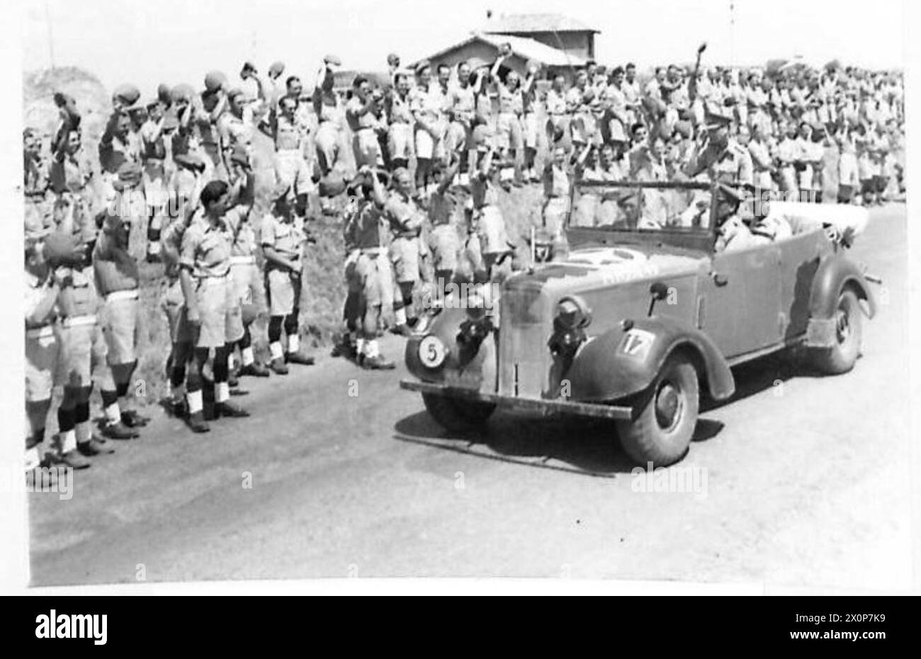 H.M. THE KING VISITS 5TH CORPS - His Majesty the King passes cheering ...