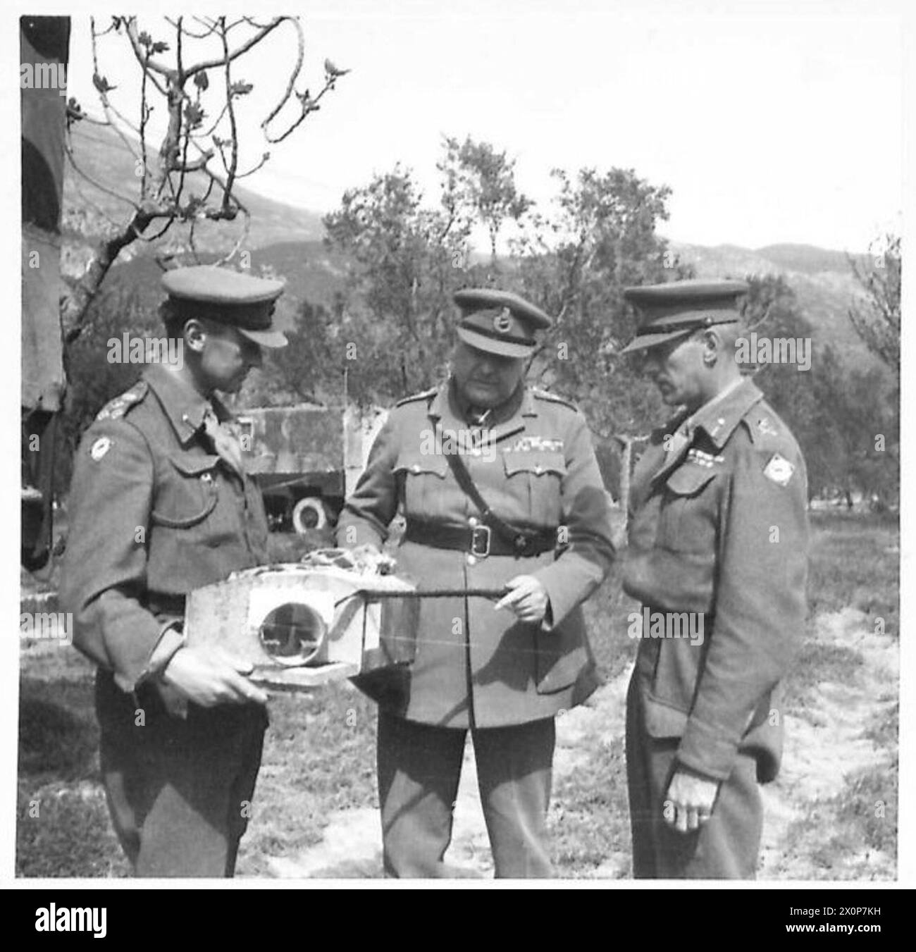 General Wilson and Lieutenant General Kirkman of the 8th Army examine a ...