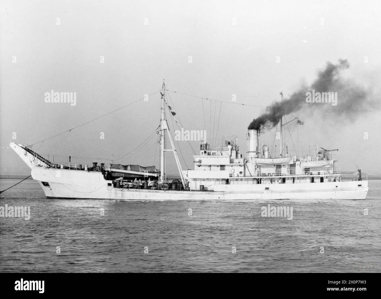 THE MOORSMAN, BRITISH MOTOR VESSEL, A MOORING LIGHTER. 1945, AT SEA ...
