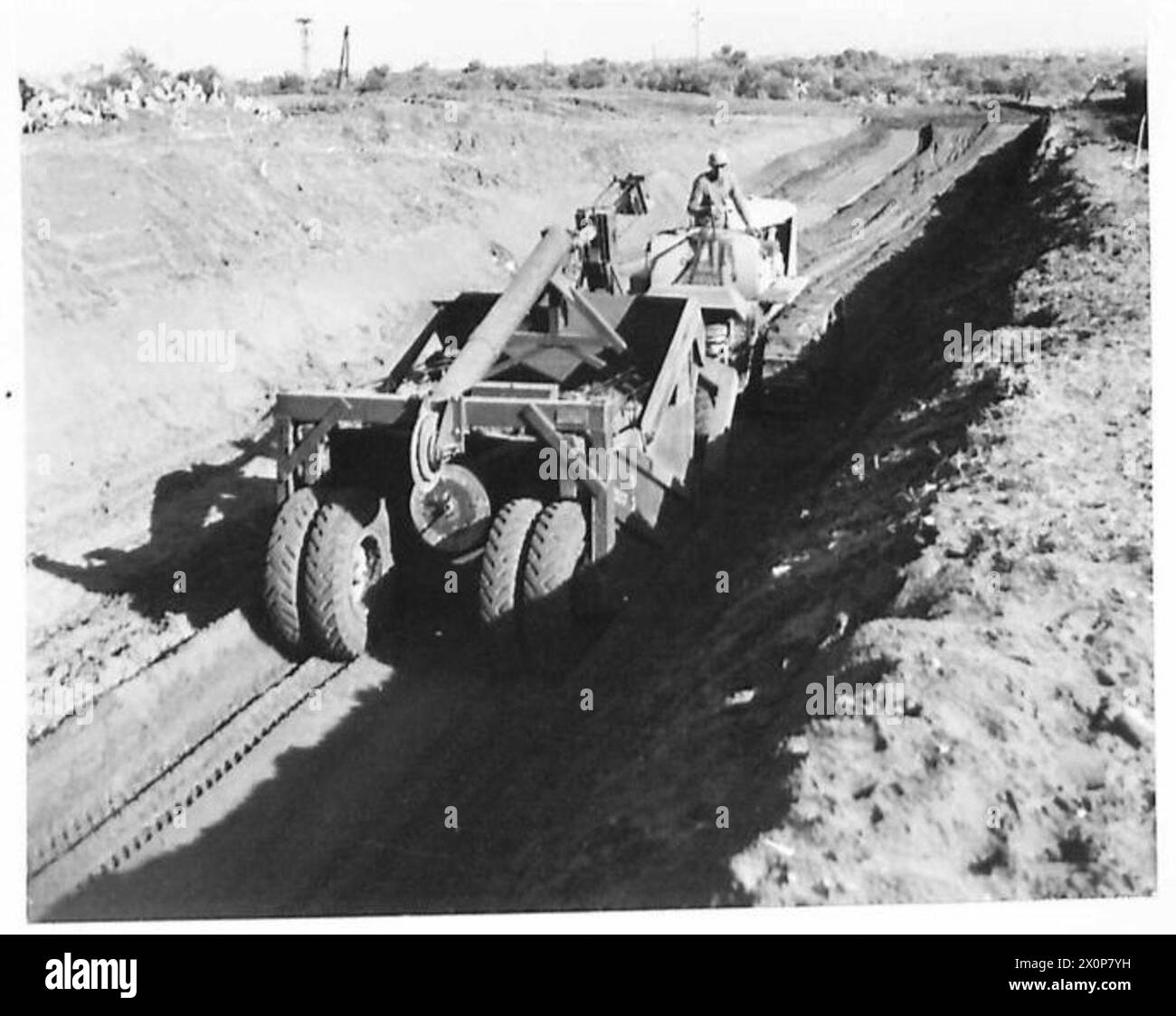 BUILDING THE HAIFA-TRIPOLI RAILWAY - A "Carryall Scraper" hauled by a ...