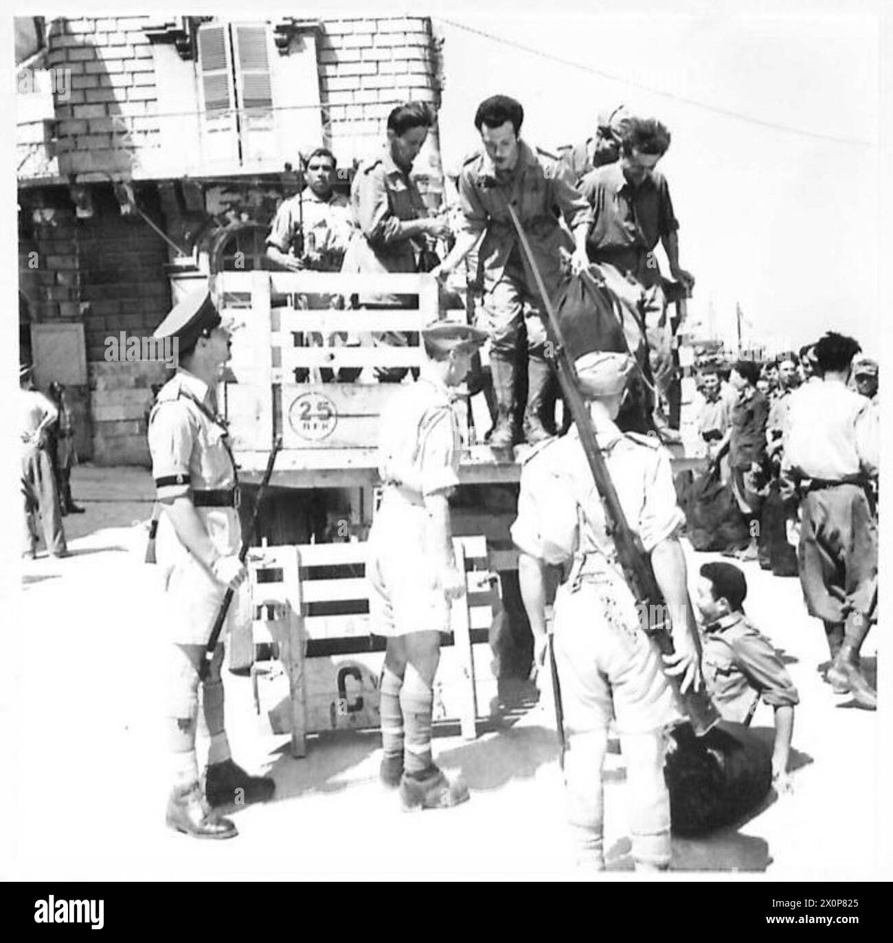 Sicilian prisoners descend from a truck at the Customs House steps in ...