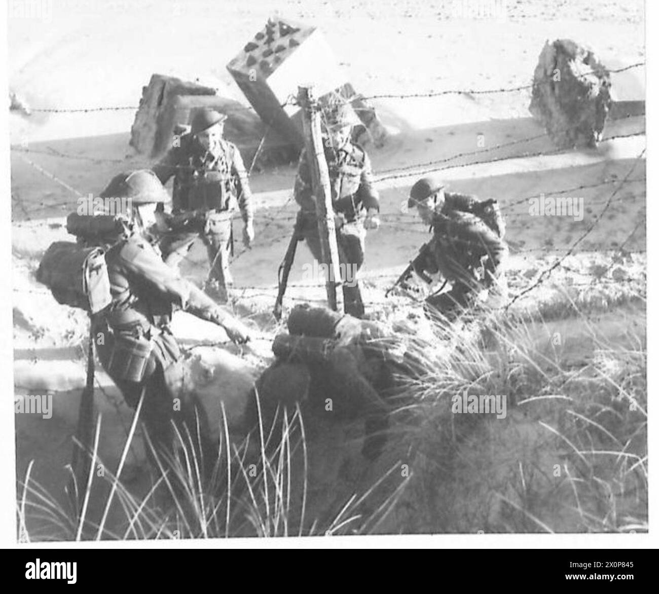 NORWEGIAN FORCES ON EXERCISES - Climbing through a barbed wire fence to ...