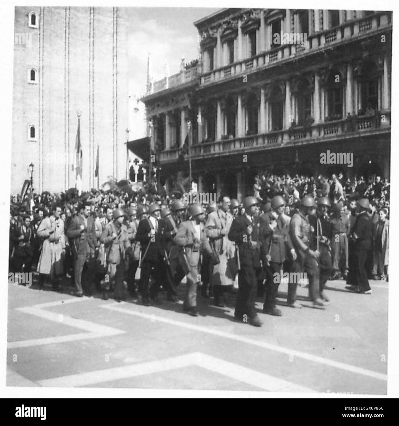 Italian partisans march past in formation during a parade in Piazza San ...