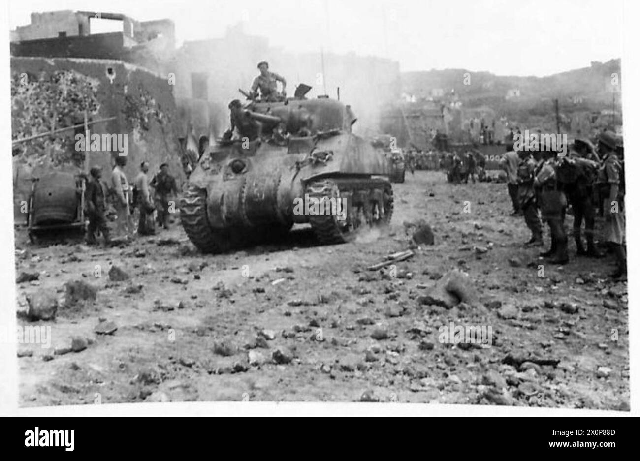 Photograph showing Sherman tanks landing at Pantelleria with one tank ...