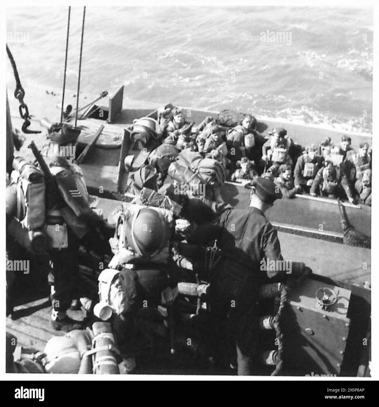 Commandos in full kit practice amphibious operations during a Combined Operations exercise ...