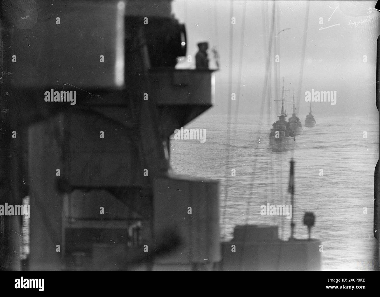 ON BOARD THE BATTLESHIP HMS RODNEY AT SEA. 1940. - Destroyers escorting ...