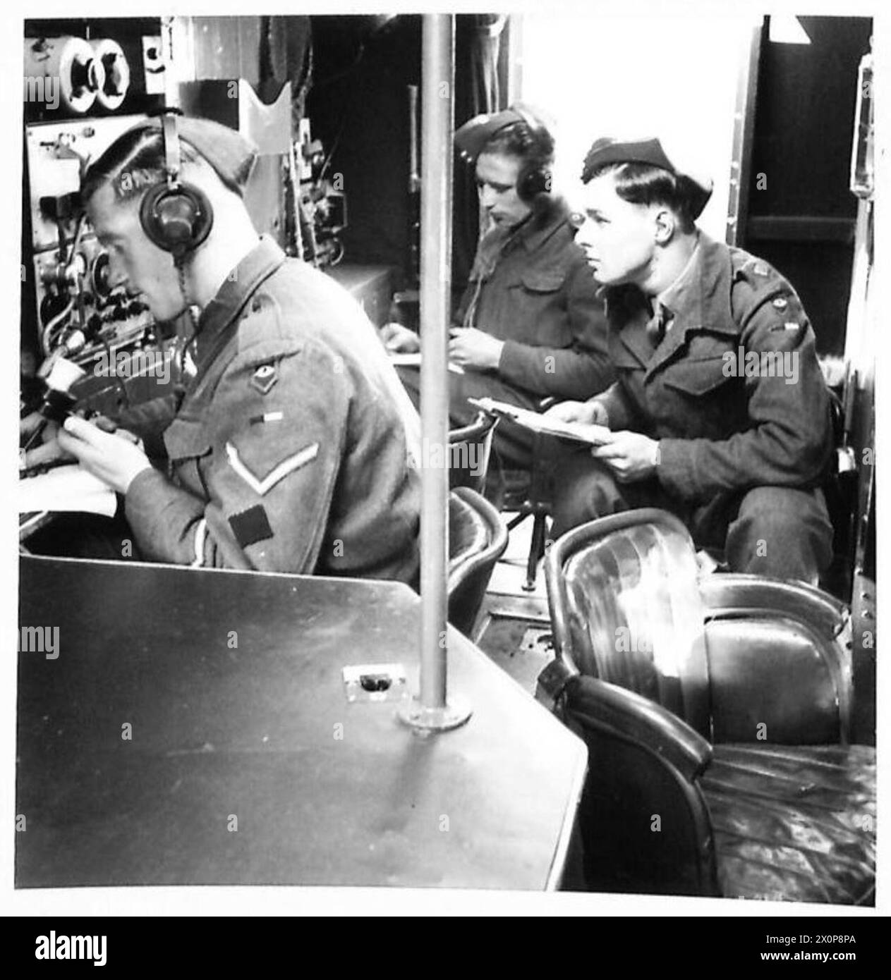 SIGNALLERS AT WORK IN THE FIELD - Interior of an Armoured Command ...