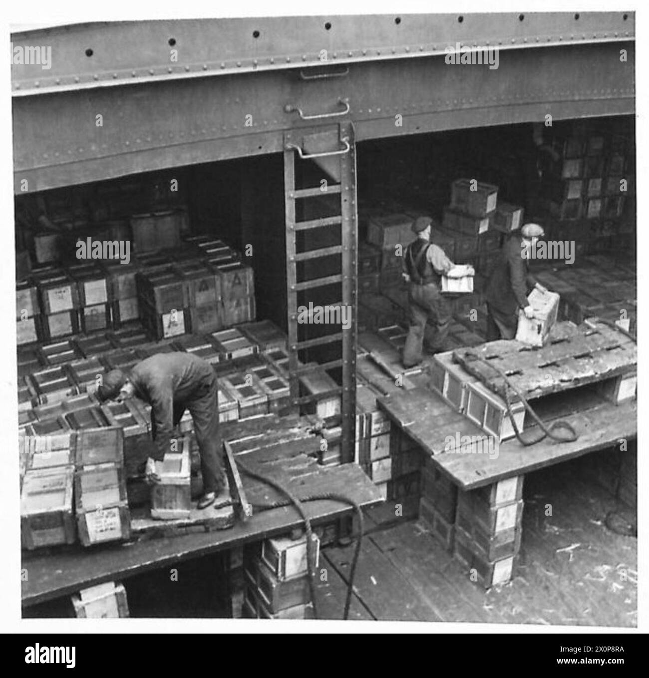 LOADING COMPO PACKS INTO SHIPS - Compo packs being loaded into a ship ...