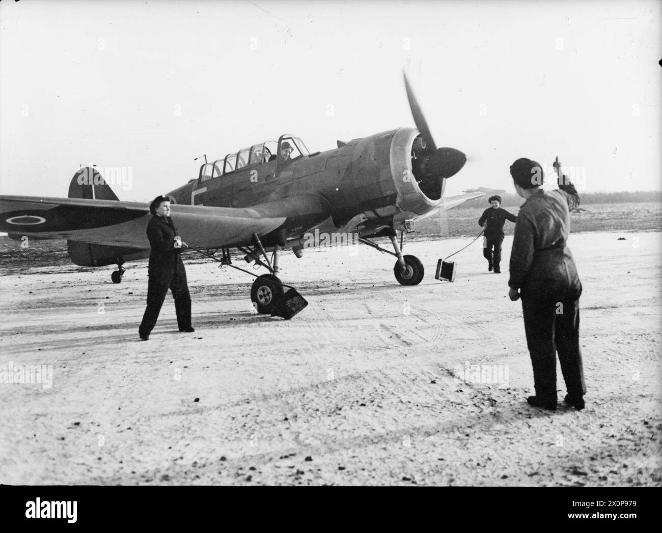WAAF flight mechanics remove chocks from a Miles Martinet TT Mark I ...