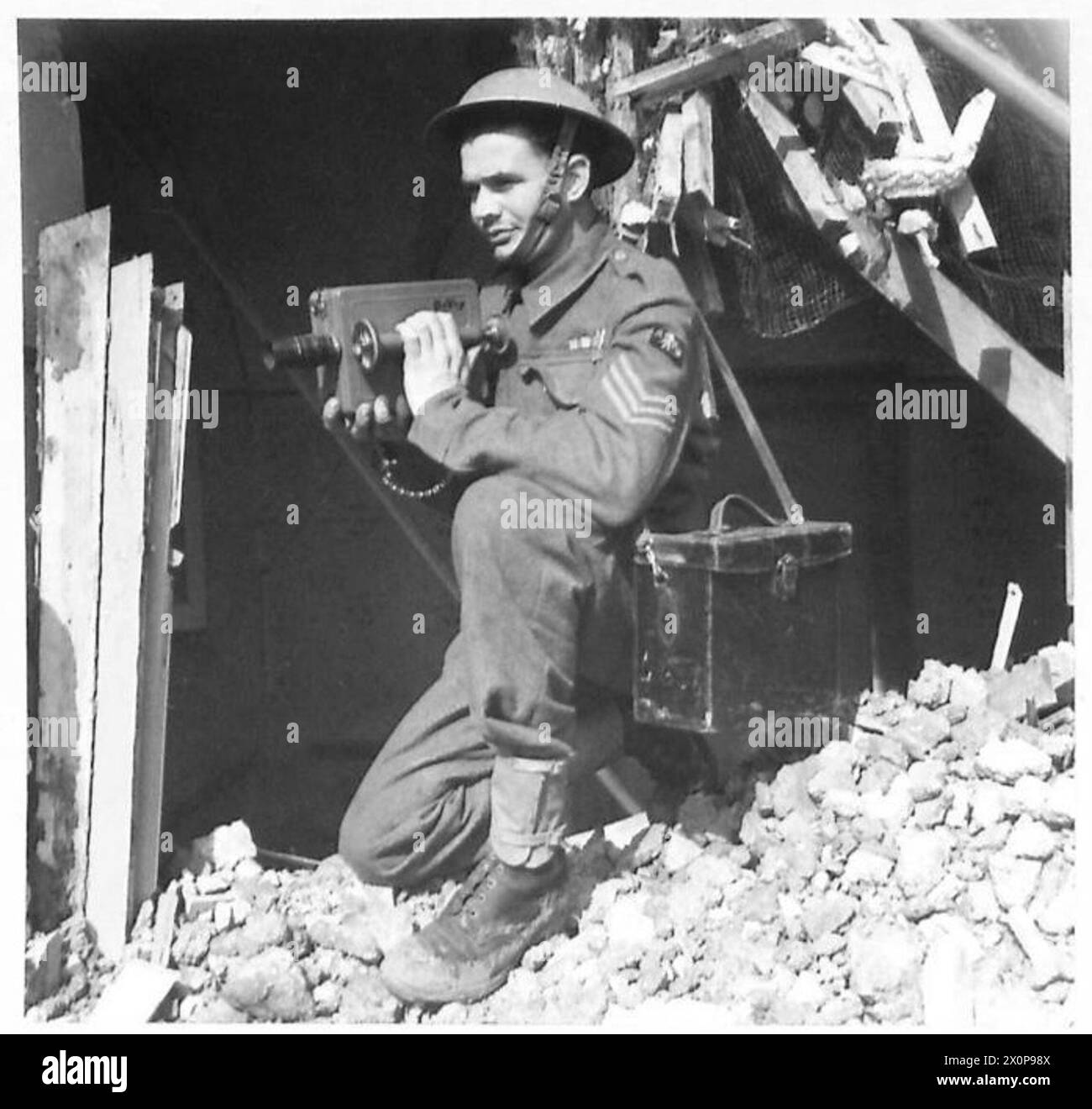 Sgt. J. Huggett films the Fifth Army’s Anzio bridgehead battle as a ...