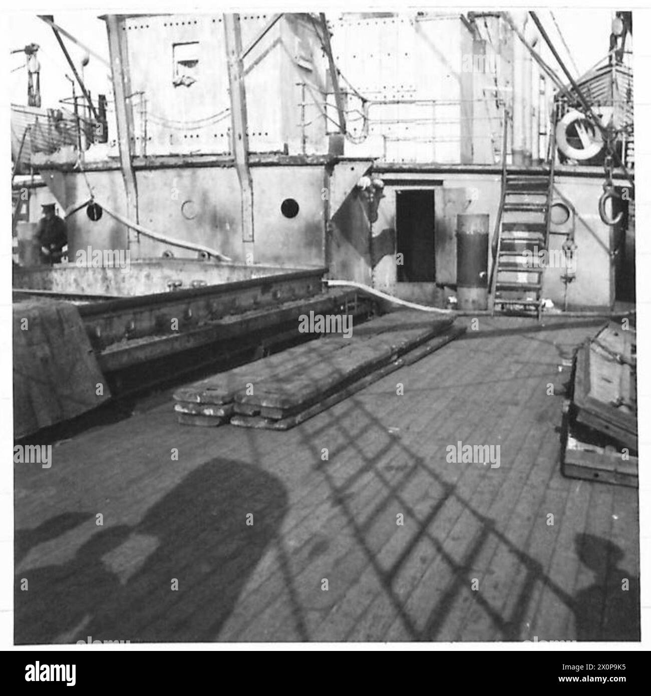 Hatch covers are stacked on the deck as part of a special assignment ...
