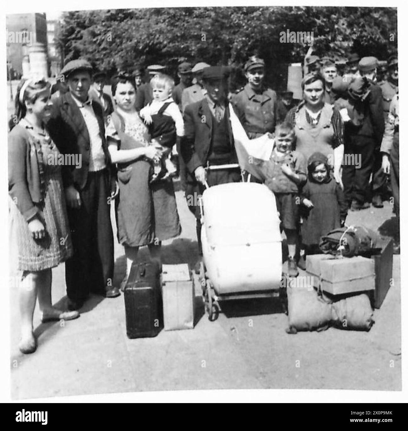 Photograph of displaced persons, including Aleksy Waszczuk and family ...