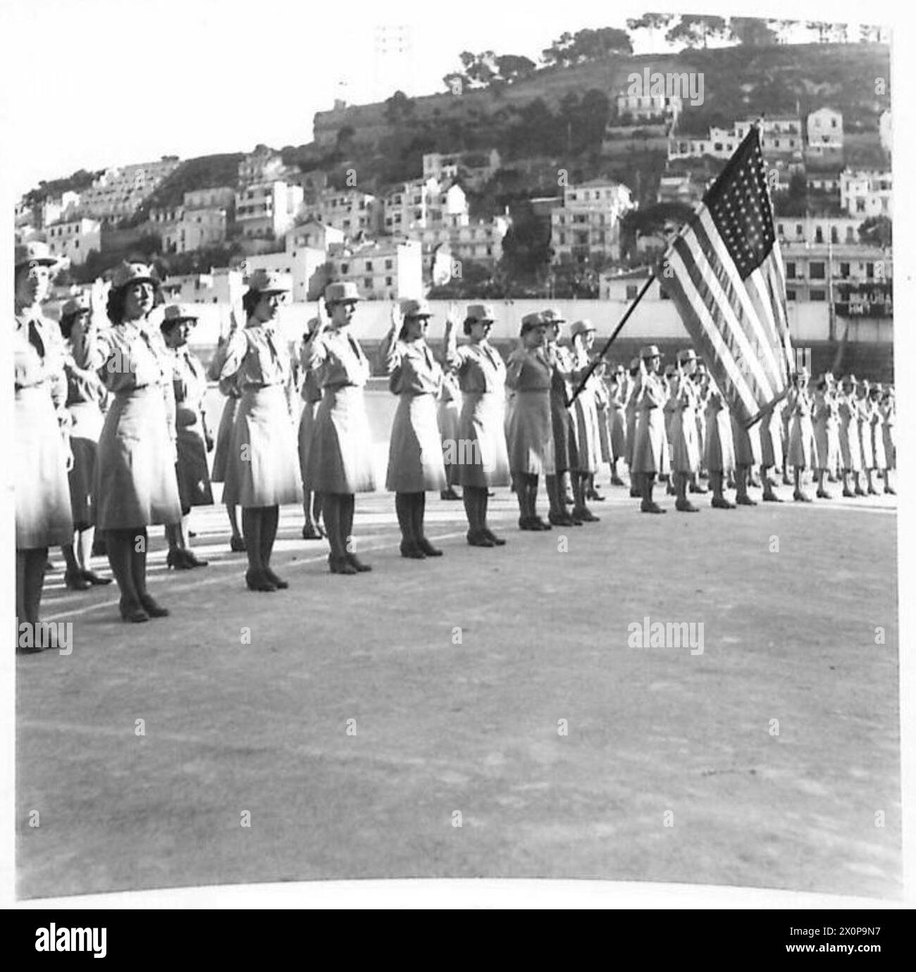 Women of the Women's Army Corps (WACs) are shown being sworn into the ...