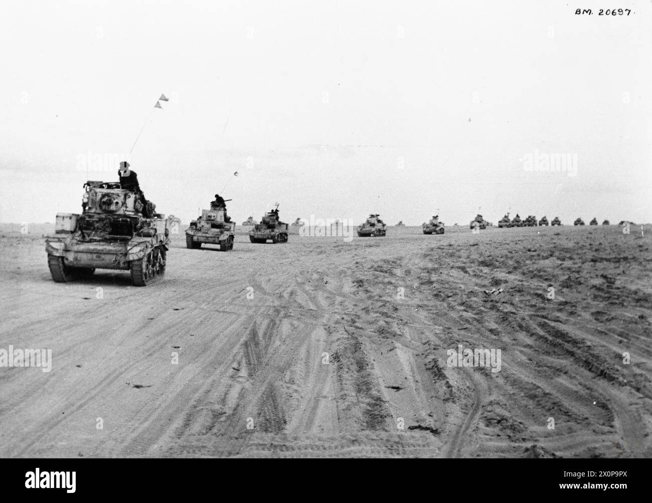A column of Stuart tanks from the British Army advances to the front in ...