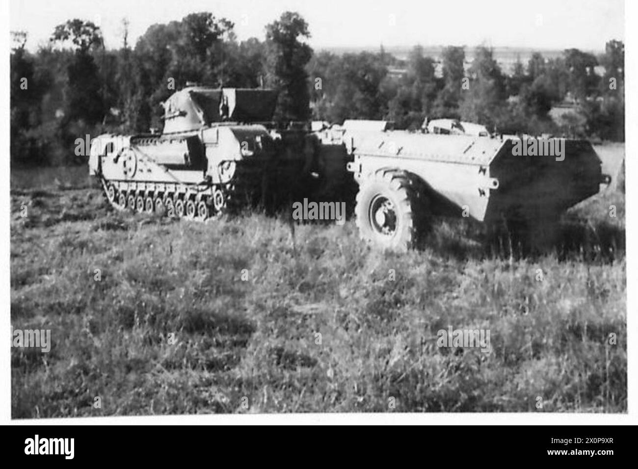 Three-quarter view of a British flame-throwing tank and trailer ...