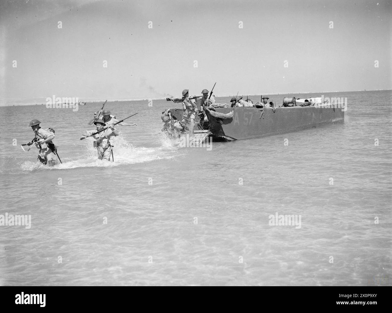 Between 8-12 June 1943, army assault troops land from invasion craft ...
