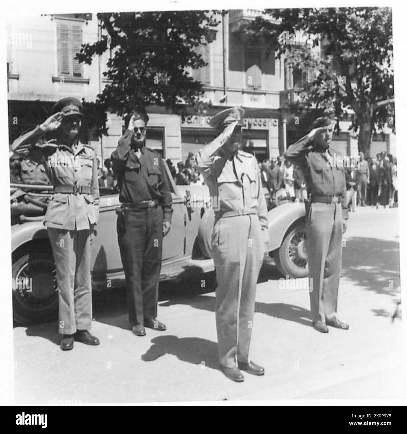 GENERAL McNARNEY IN TRIESTE - General McNarney takes the salute before ...