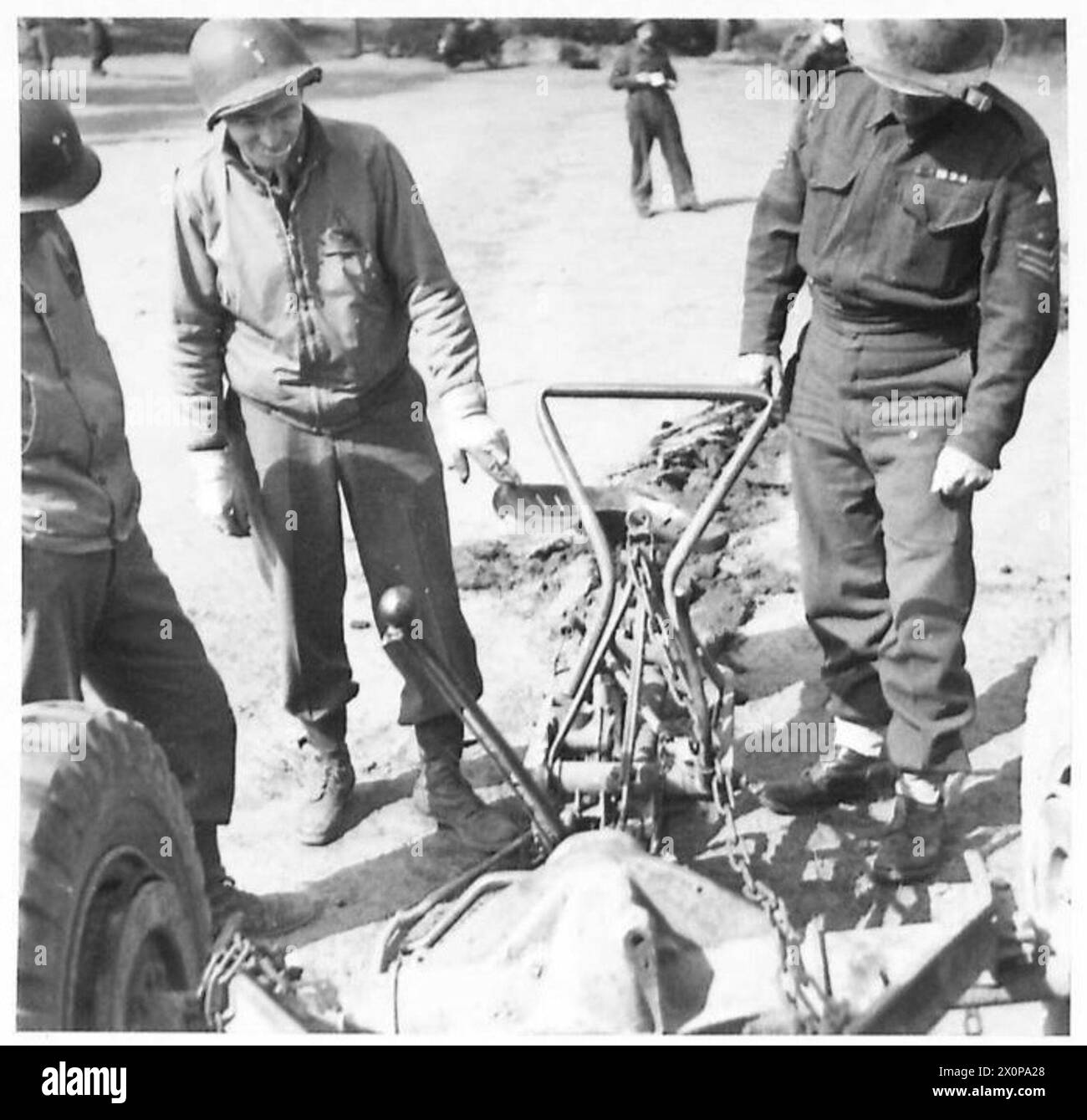 Sgt. J. Nobile uses an improvised cable plough made from an old Italian ...