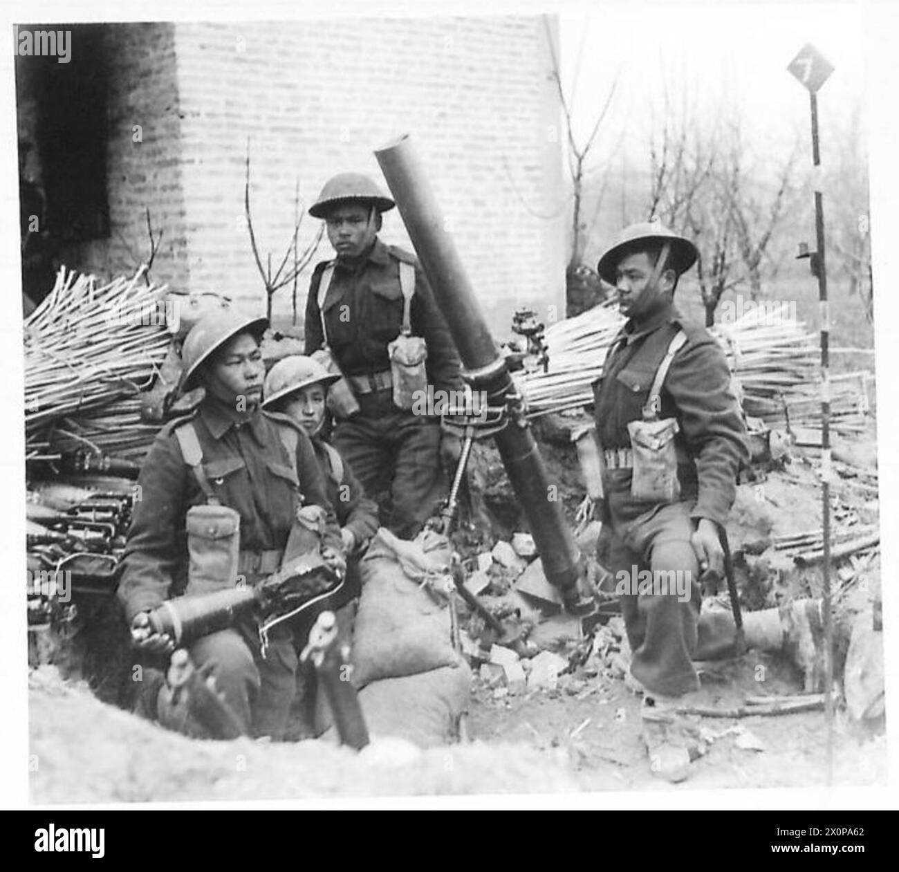 Gurkha soldiers of the British Army prepare a mortar for firing during ...