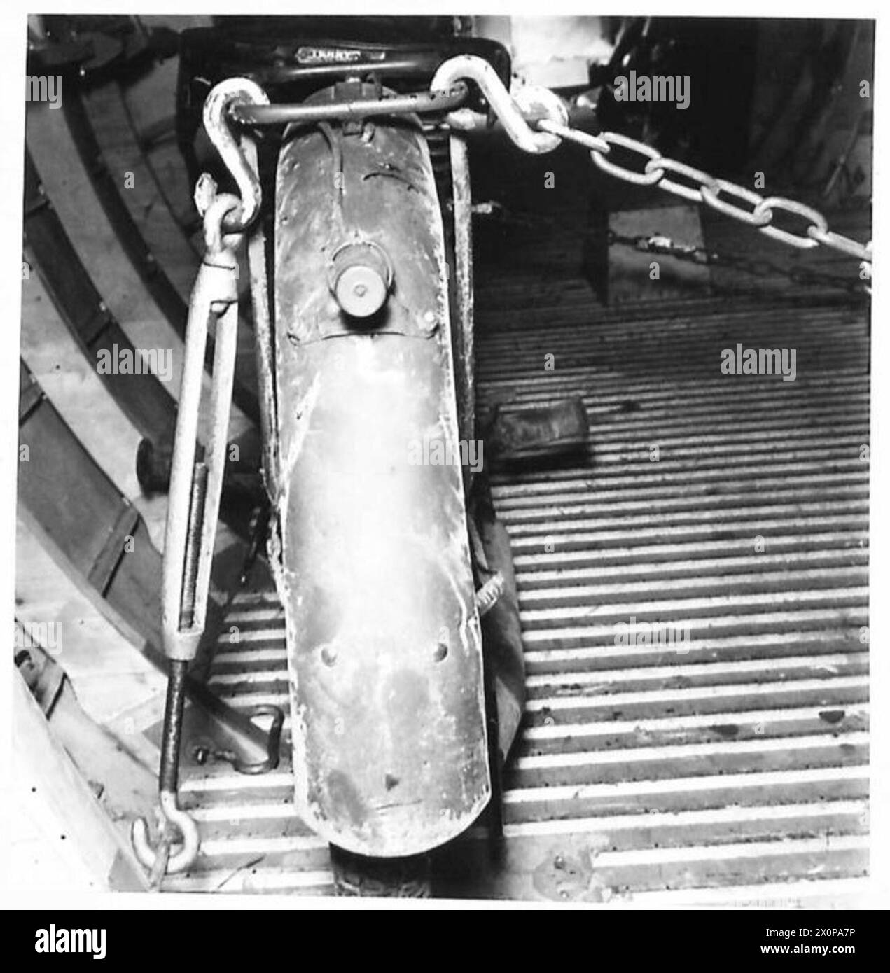 Motorcycles are lashed together and transported inside a military ...