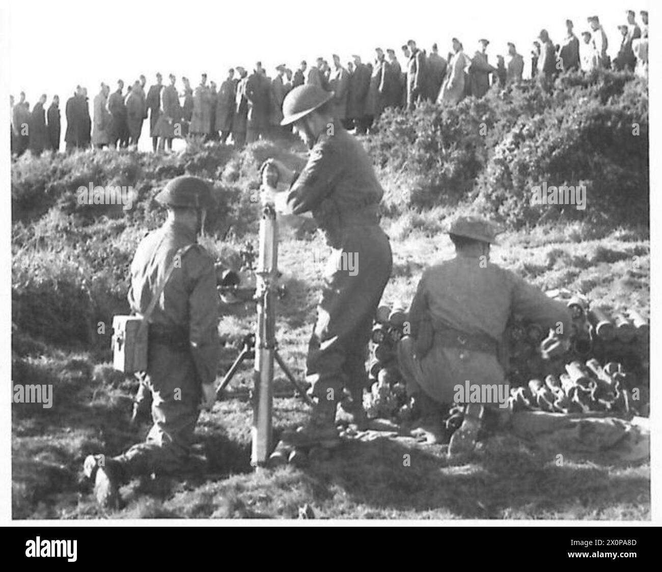 A mortar crew demonstrates operation of the weapon to visiting American ...