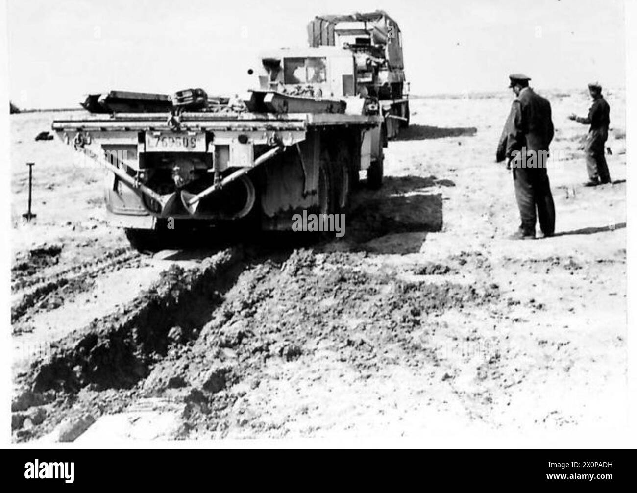 With the tank’s weight removed, the bogged transporter is towed out of ...