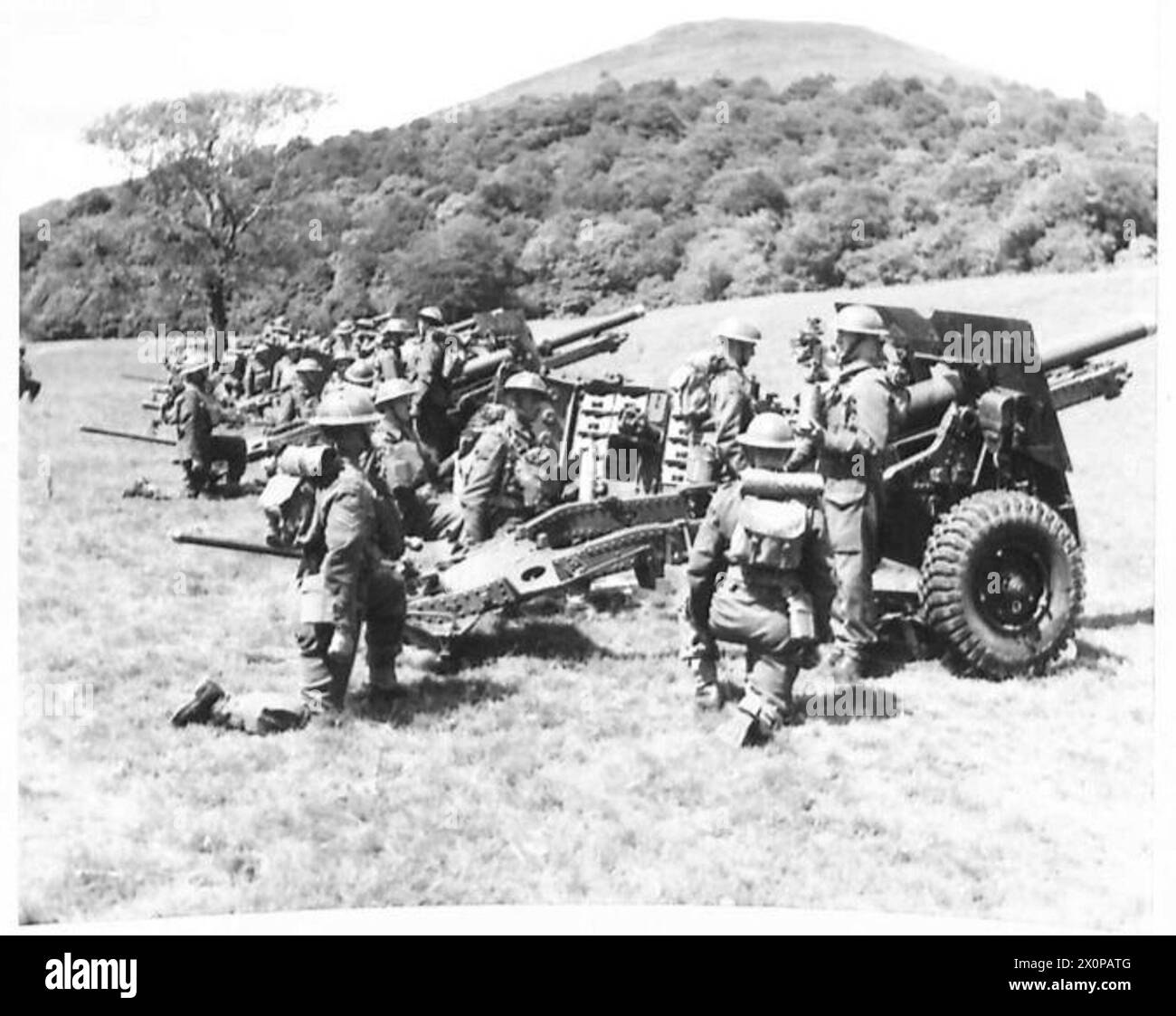 Artillery guns are prepared for action during British Army training ...