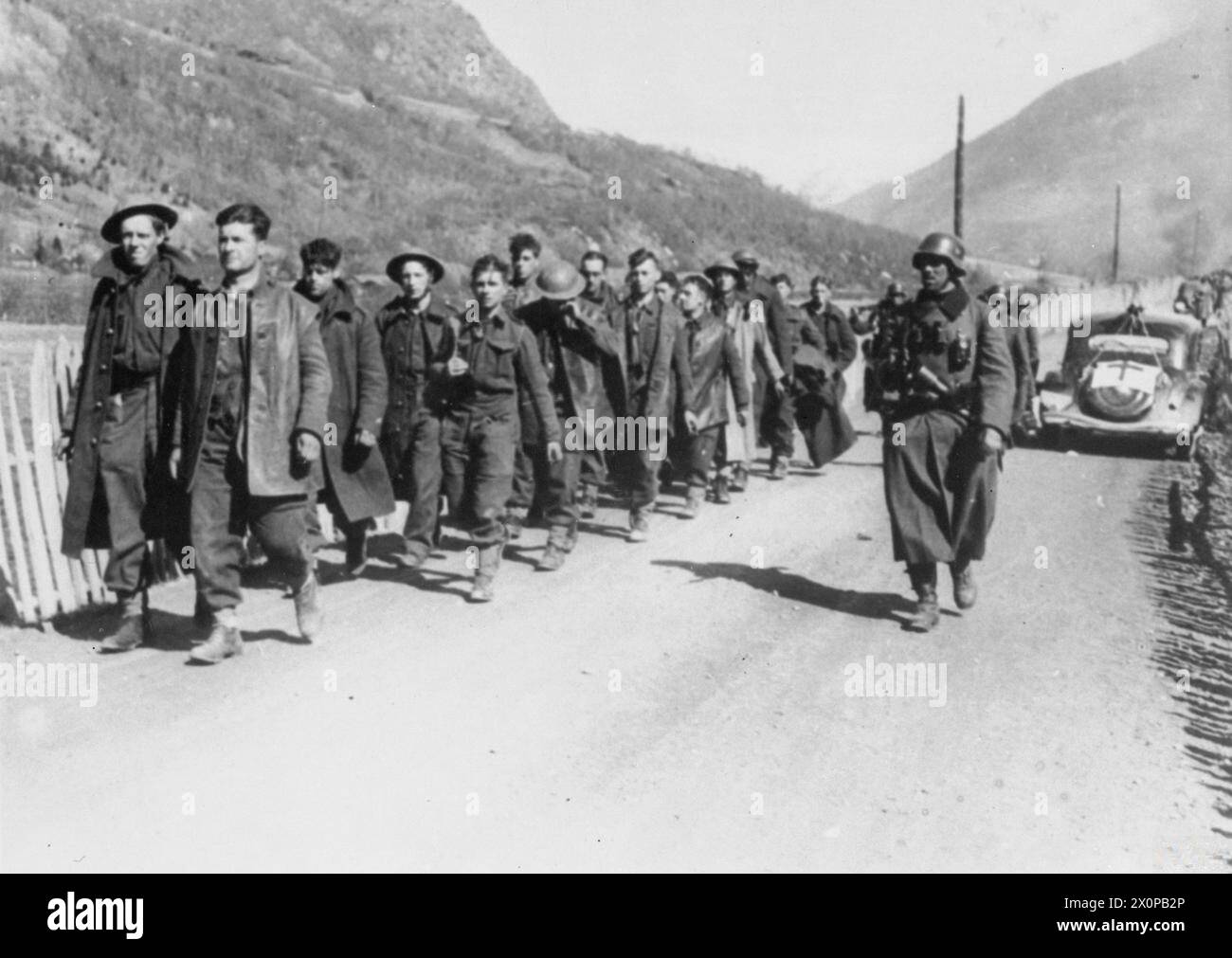 German troops escort British prisoners of war to the rear on 29 April ...