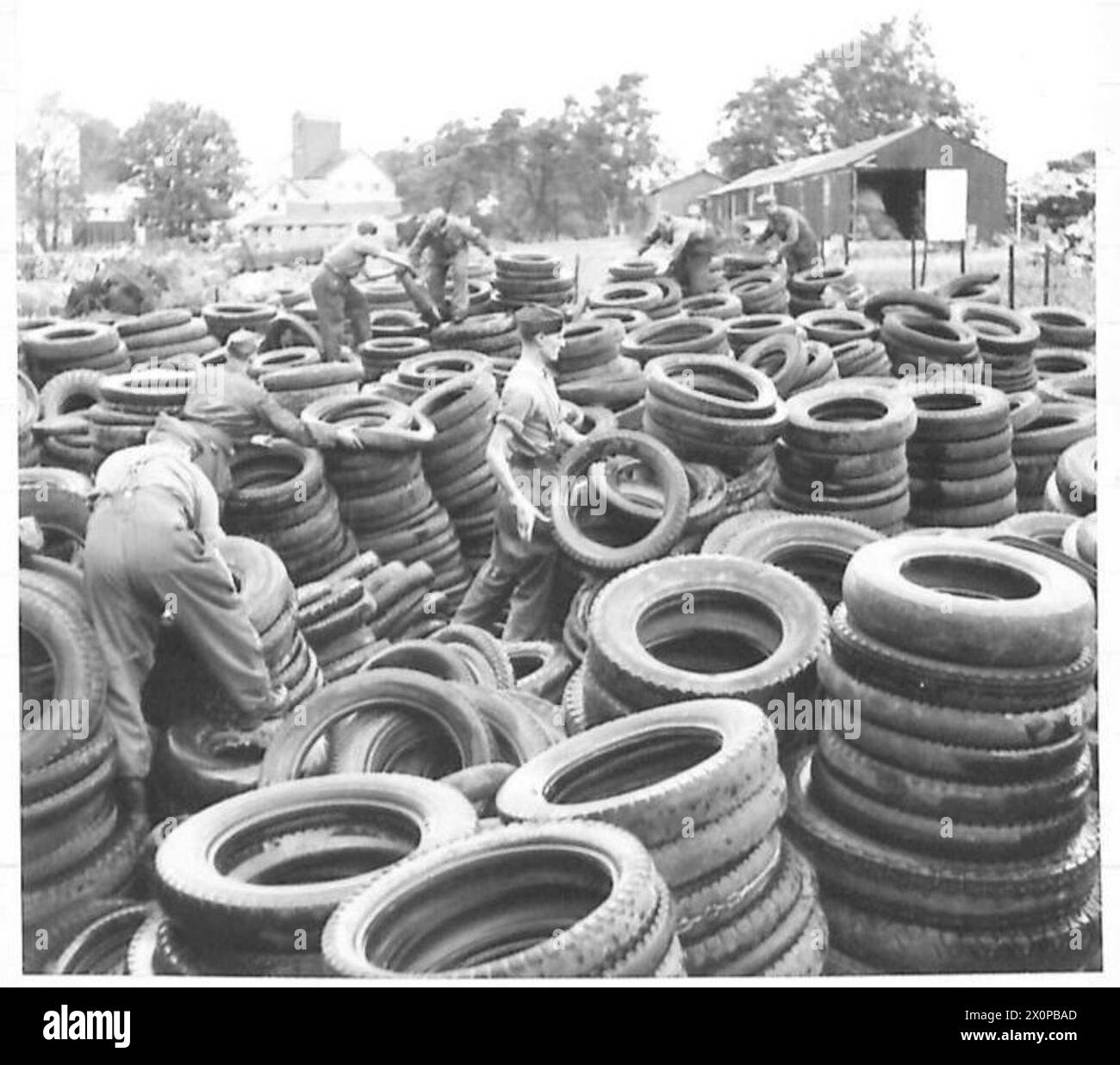 EXTENSIVE SALVAGE IN THE EASTERN COMMAND - Soldiers stack another area ...