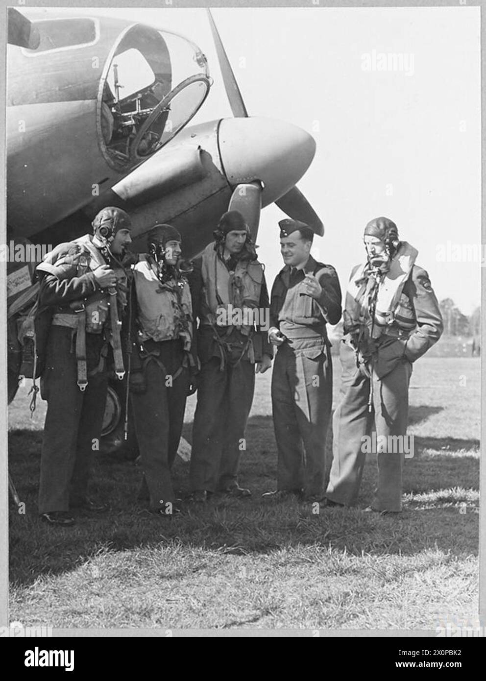 Photograph showing Wing Commander Reynolds briefing Mosquito Squadron ...