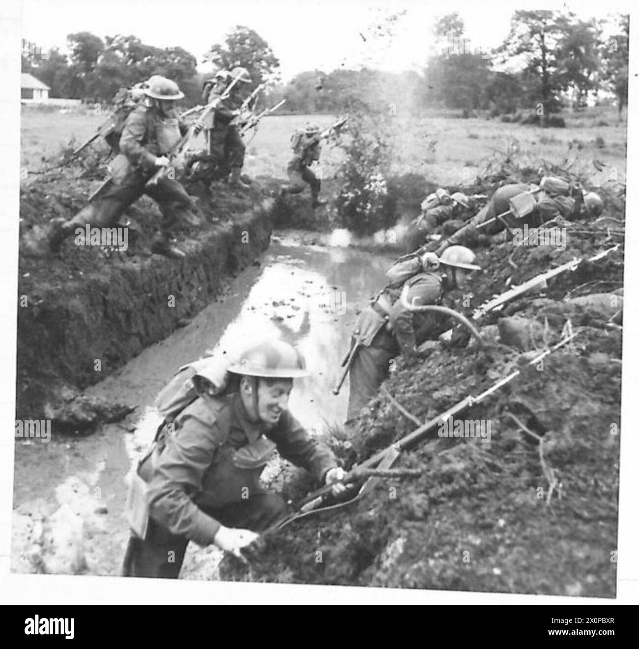 HARDENING UP IN NORTHERN IRELAND - Troops jumping a ditch during the ...