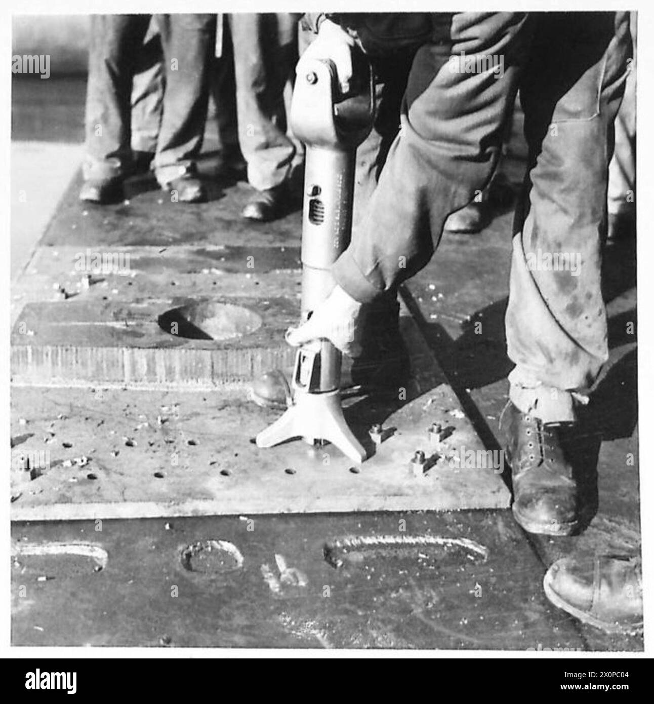 Demonstration of the bolt gun in use by TN.5, installing the base and ...