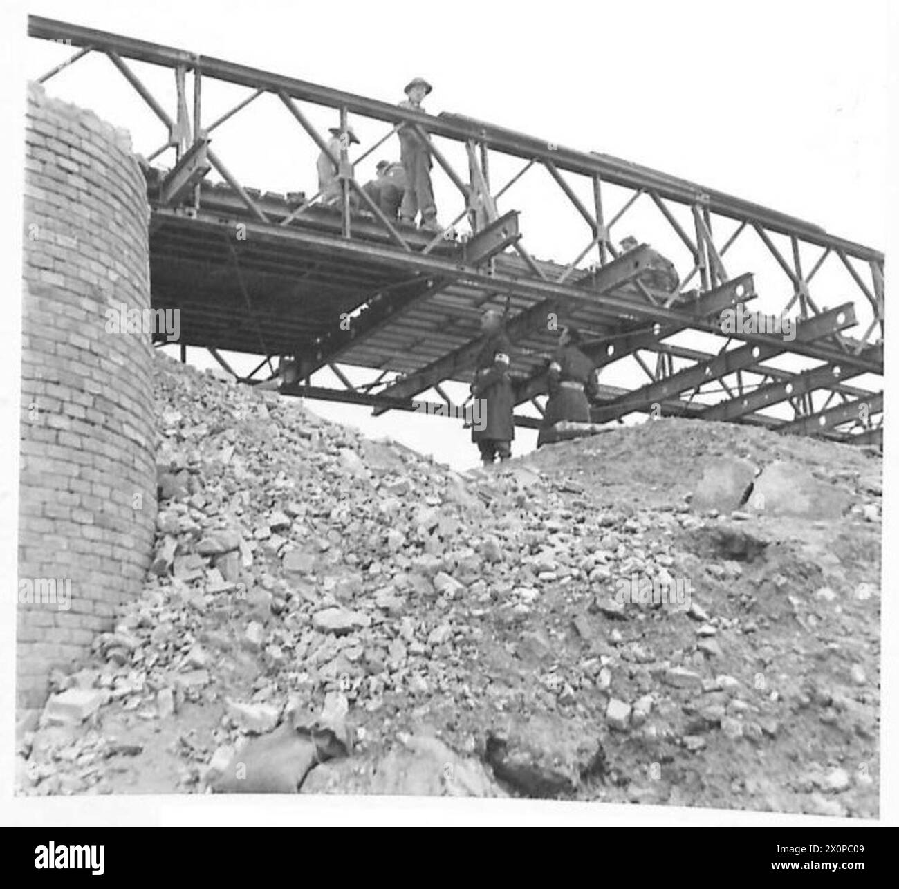 British Army engineers lay wooden boards forming the roadway of the ...
