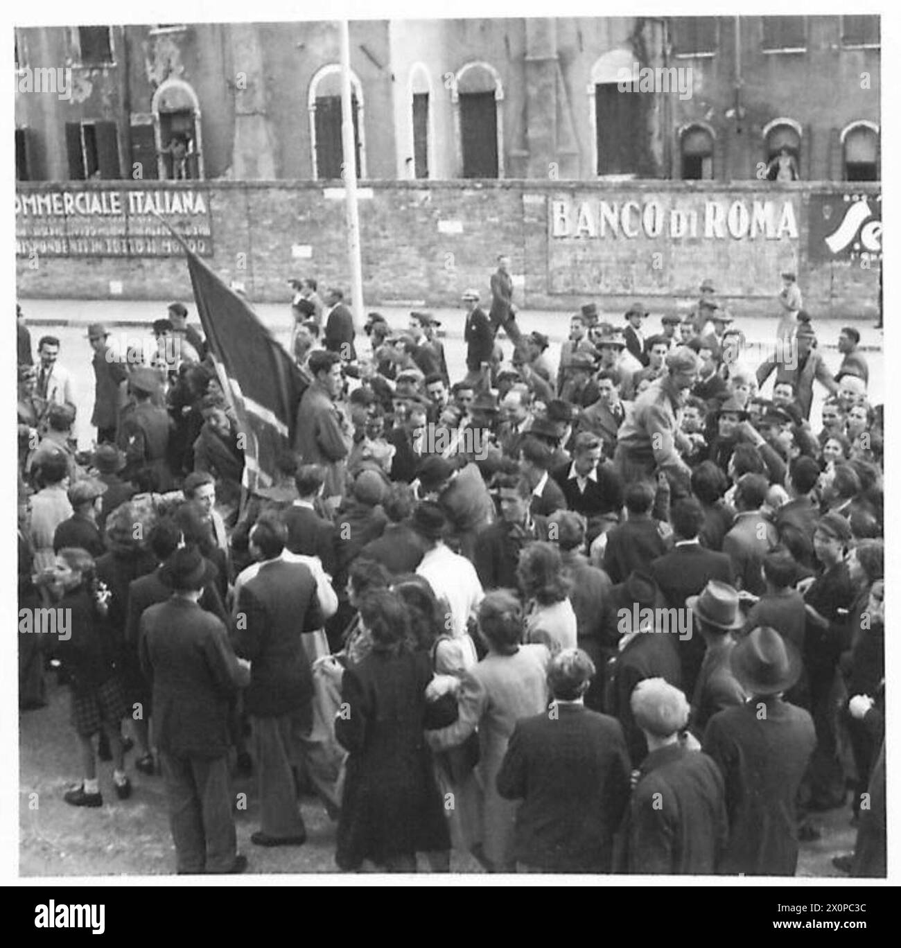 EIGHTH ARMY ENTER VENICE - A crowd of Venetians clap and cheer as ...