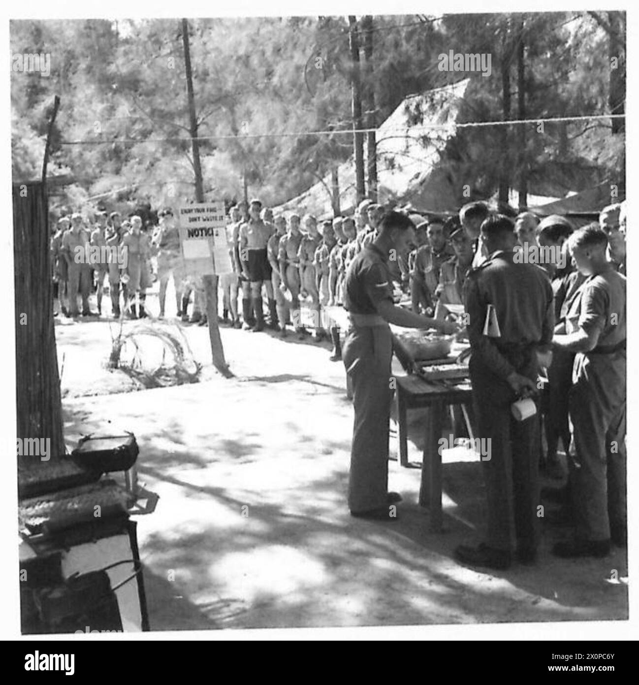 Soldiers line up for dinner as documented by photographs requested by ...