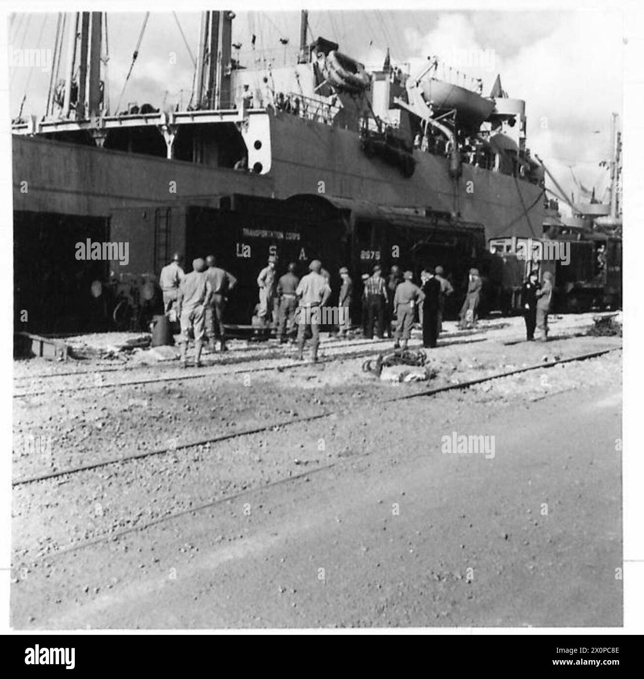 PHOTOGRAPHS OF PREFABRICATED PORT, ETC. - Loco landed from ship ...