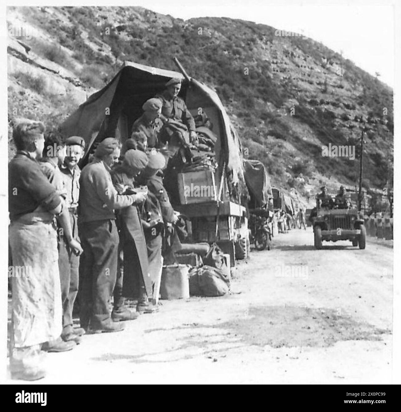 SQMS Vodden of Cardiff issued battledress to men of 78 Field Squadron ...