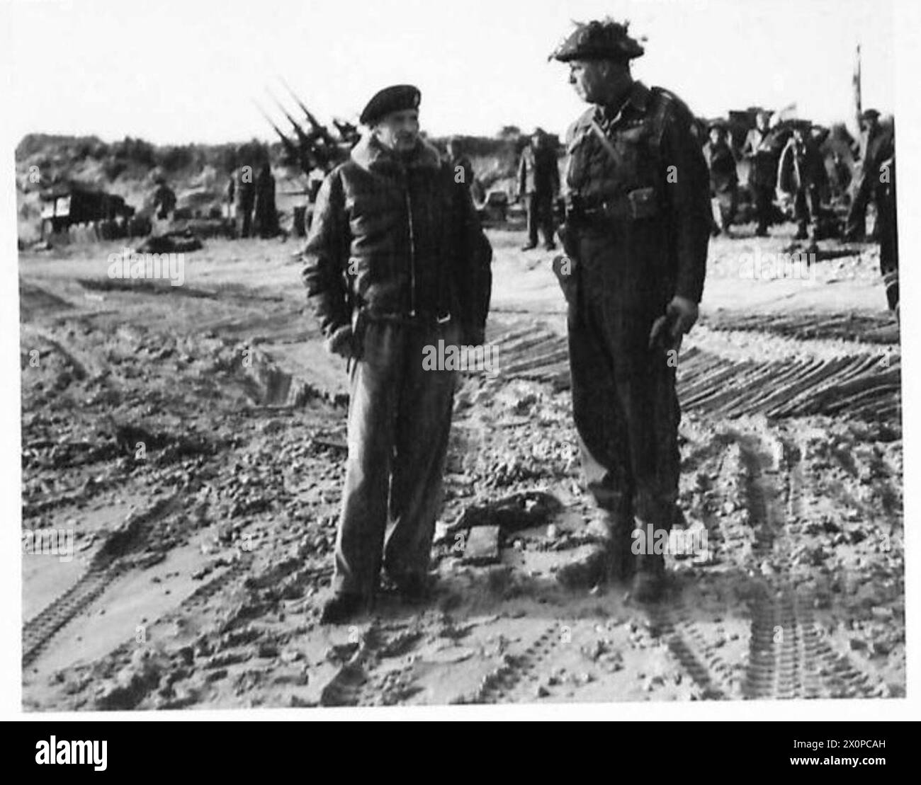 General Montgomery speaks with a Beachmaster on the beach following his ...