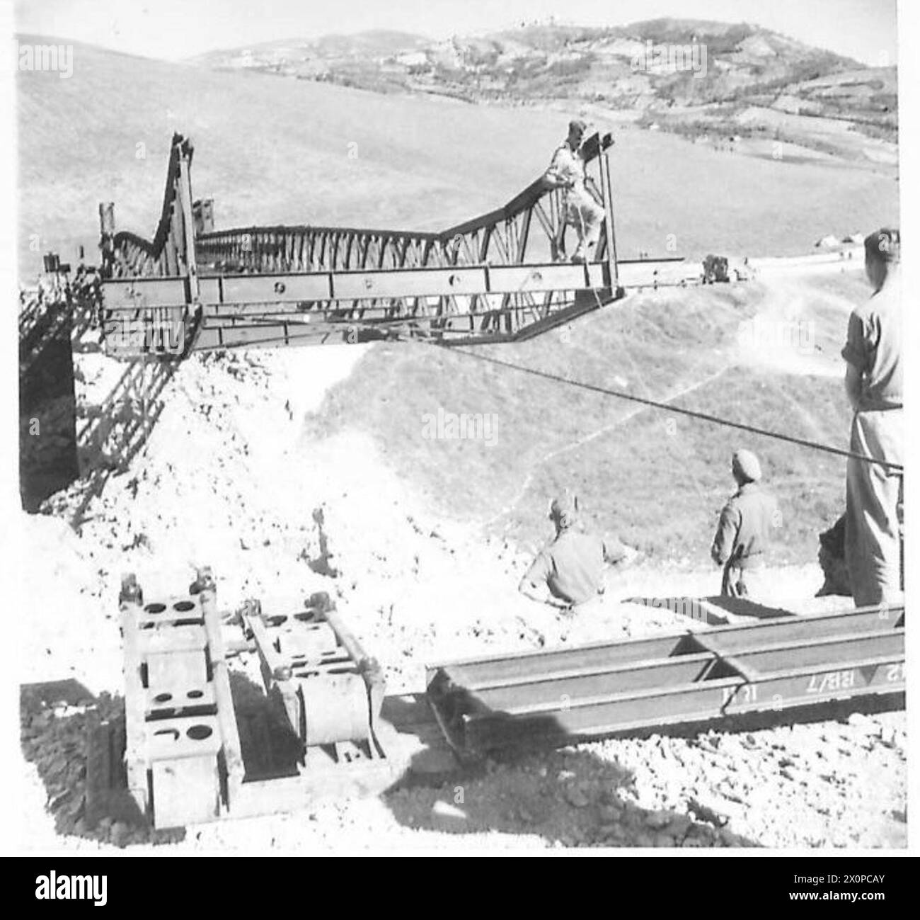 THE BAILEY BRIDGE - Nearing the far side. The rollers, which will take ...