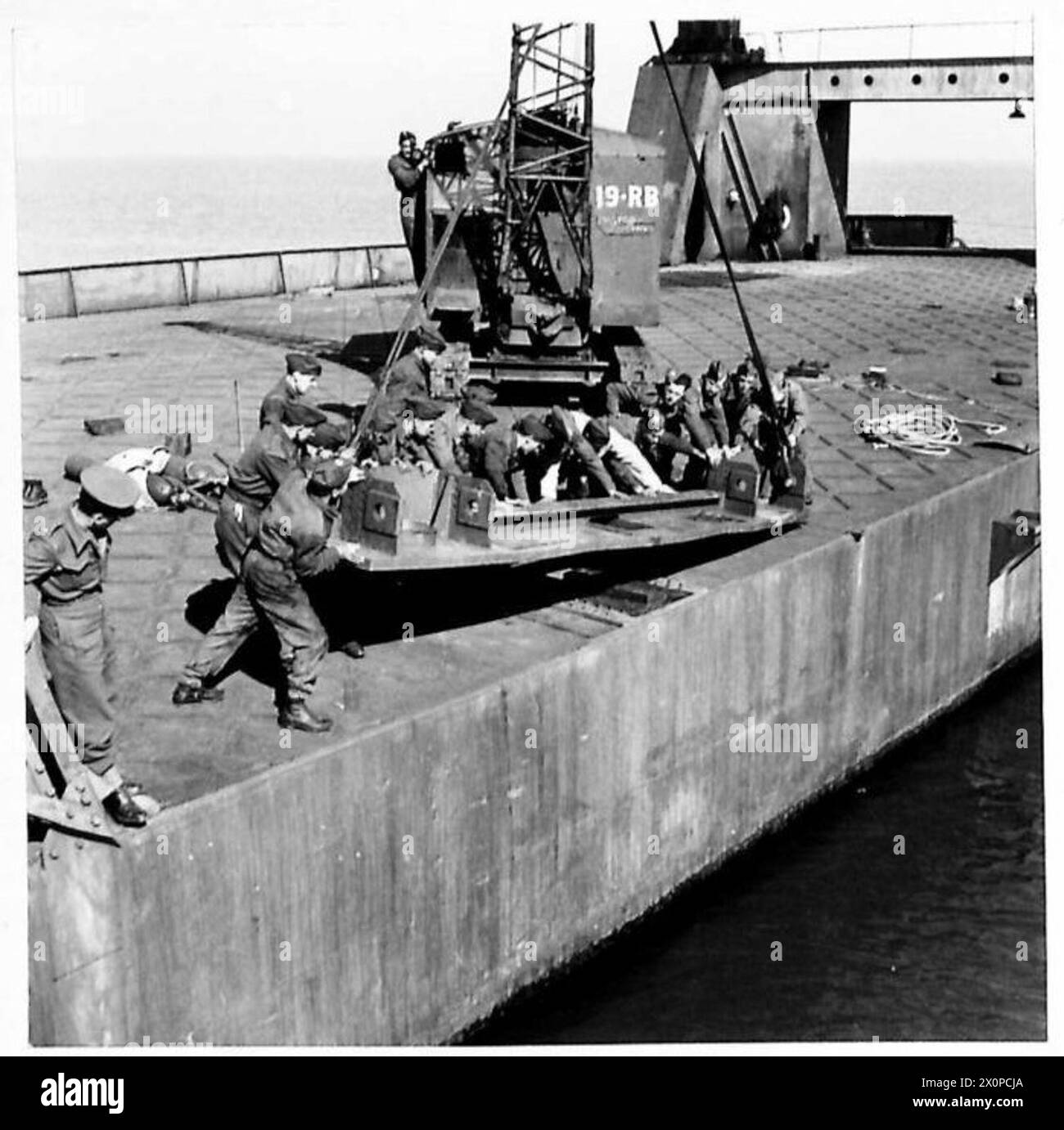 SPECIAL ASSIGNMENT FOR TN.5 - Showing the bolt gun in use, fixing the ...