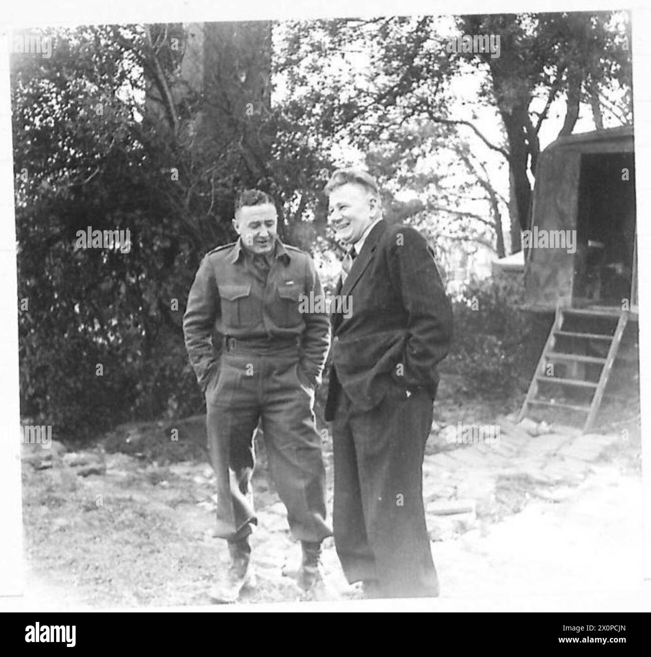 The Hon. D. Sullivan speaks with Major J.L. Griffiths, A.D.C. to ...