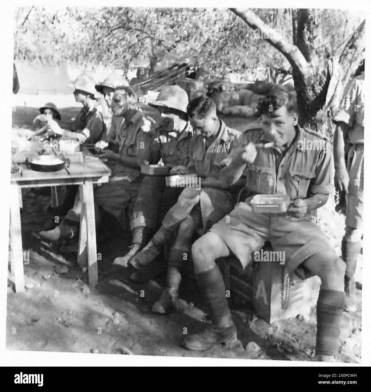 British personnel in Cyprus are shown having an outdoor meal. The ...