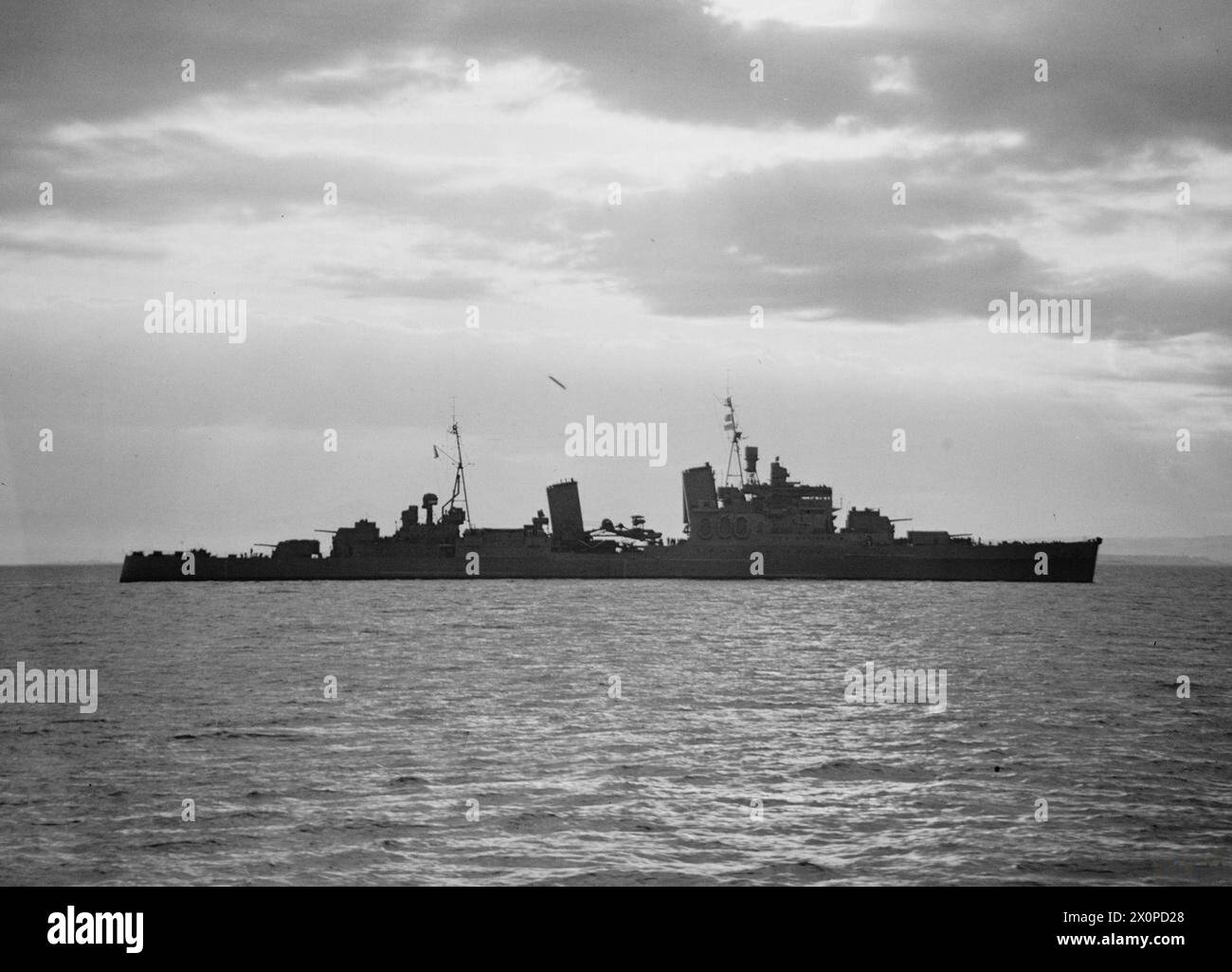 HMS Manchester is photographed from HMS Ashanti on 3 July 1942 during ...