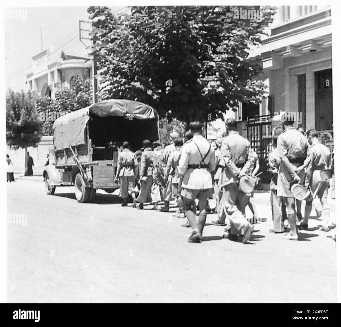 A funeral procession moves through the streets of Damascus. The ...