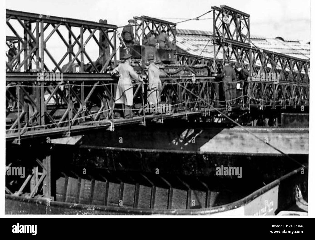 BAILEY BRIDGE CONSTRUCTION - A Churchill tank crosses and tests a ...