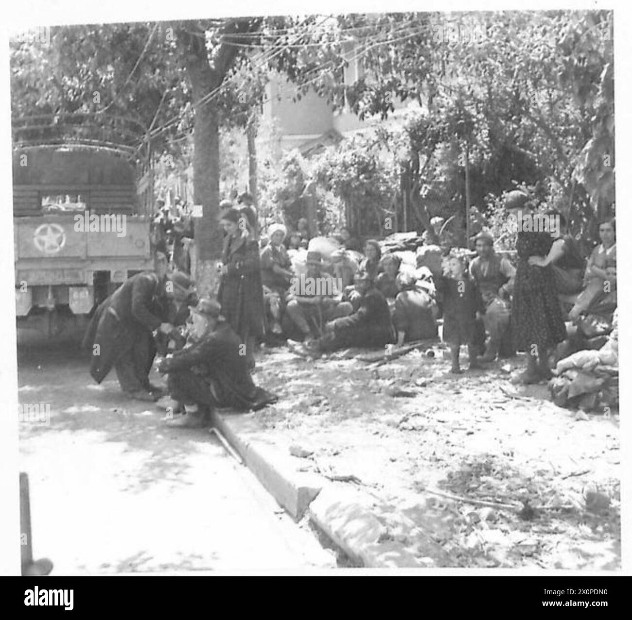 FIFTH ARMY : FALL OF VELLETRI - Refugees sit by the roadside waiting to ...