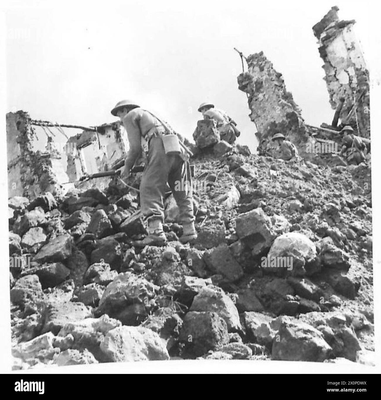 Photograph shows British Army personnel searching ruins at Cancello on ...